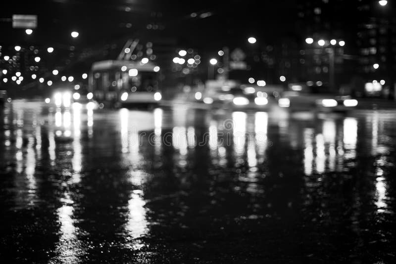 Rainy City Road at Night. Defocused Black and White Image Stock Image ...