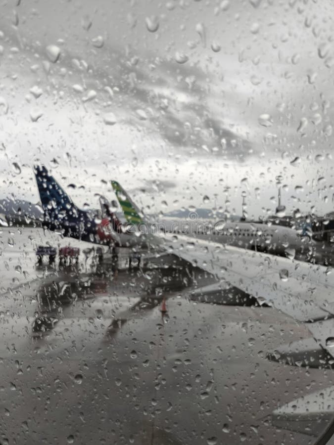 Rainy Day at an Airport, Rain Drop on the Plane Window, Plane in the ...