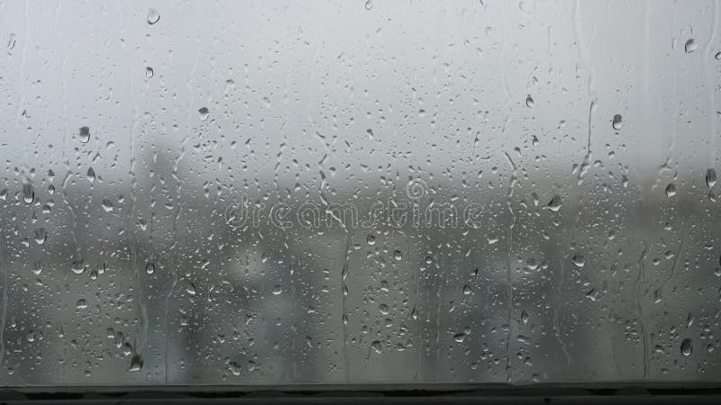 Raindrops Dripping on the Window and Windowsill in Slow Motion in ...