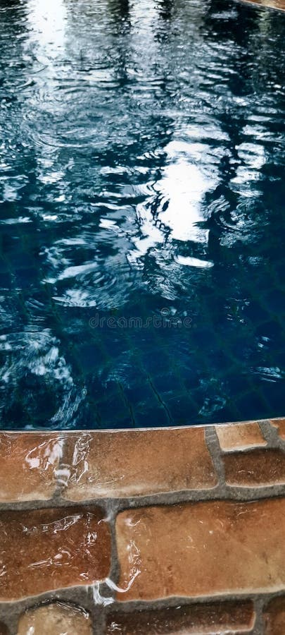 Rainy day at the pool stock photo. Image of rain, poolside - 71792590