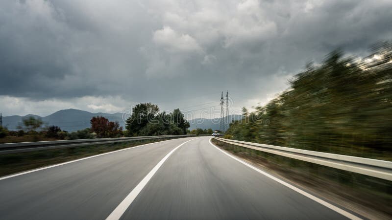 Rainy Highway View Capturing Speed and Reckless Driving on a Stormy Day ...