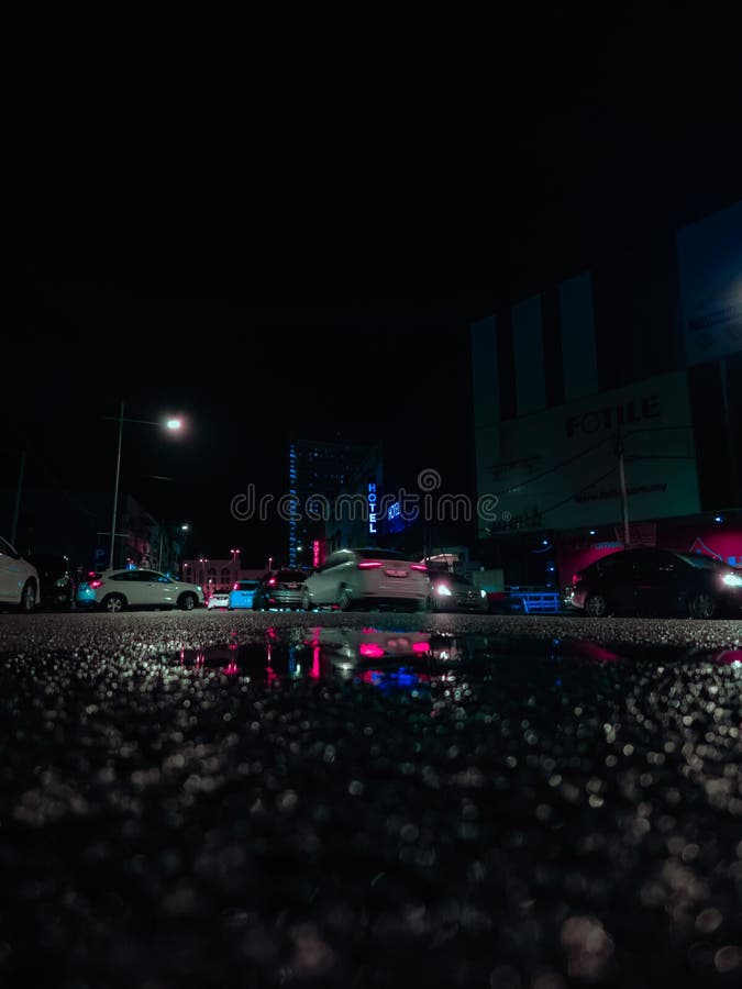Rainy Night on the Road with Reflections. Close Up View from the Water ...