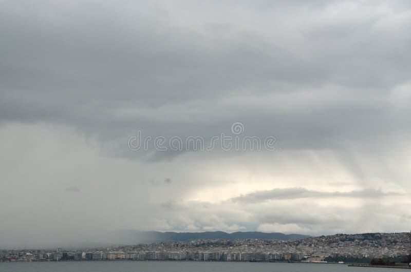 Rainy sky above city stock image. Image of cityscape - 148345103