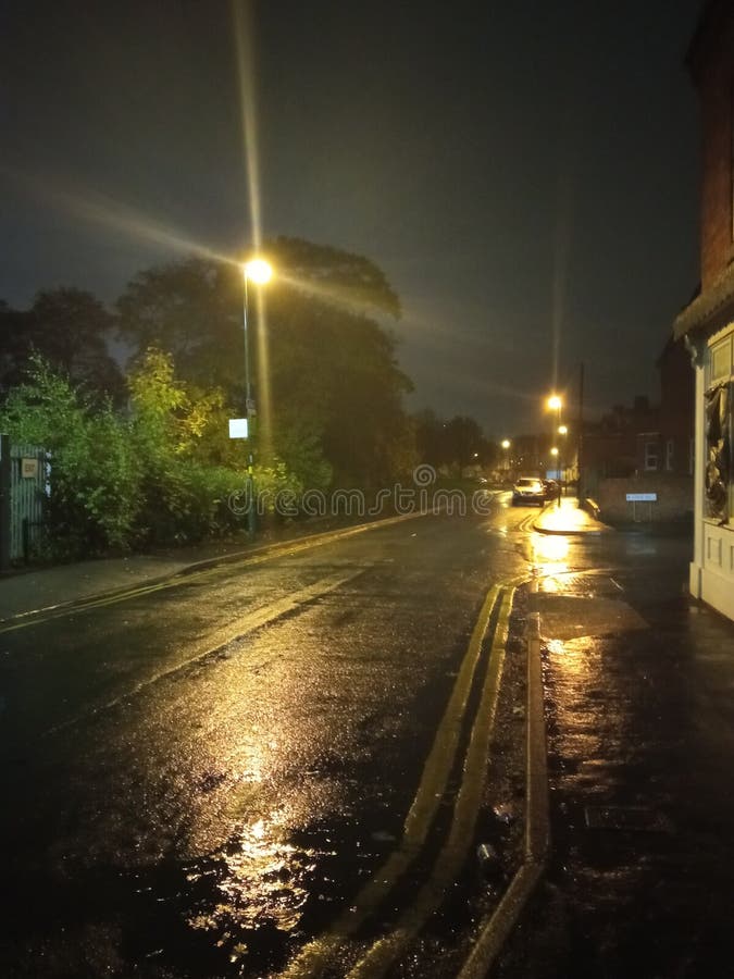 Rainy street in night stock photo. Image of streetlight - 236613424