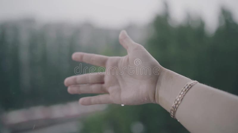 Rainy Weather, Rain Drops Falling on Womans Hand. Rain is Dropping on a ...