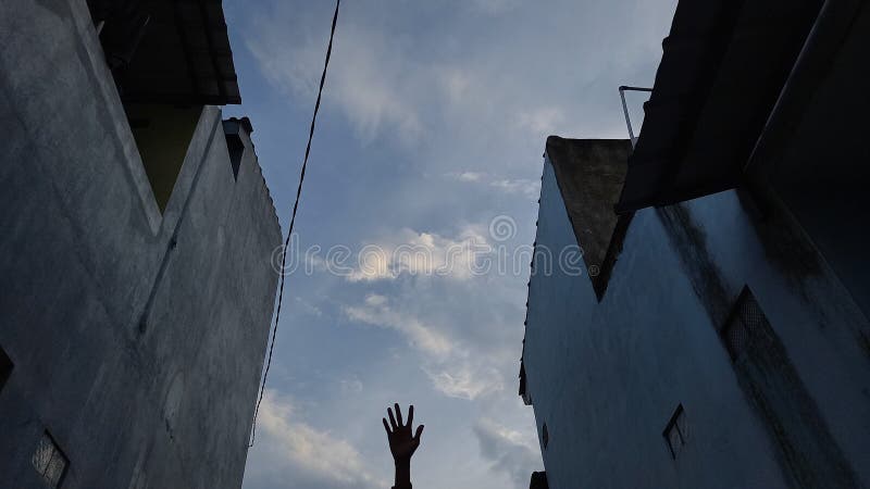 Raise One Hand between Tall Buildings Stock Photo - Image of steeple ...