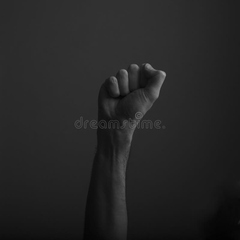 Raised Clenched Fist Against A Dark Background Power Protest Concept Stock Image Image Of