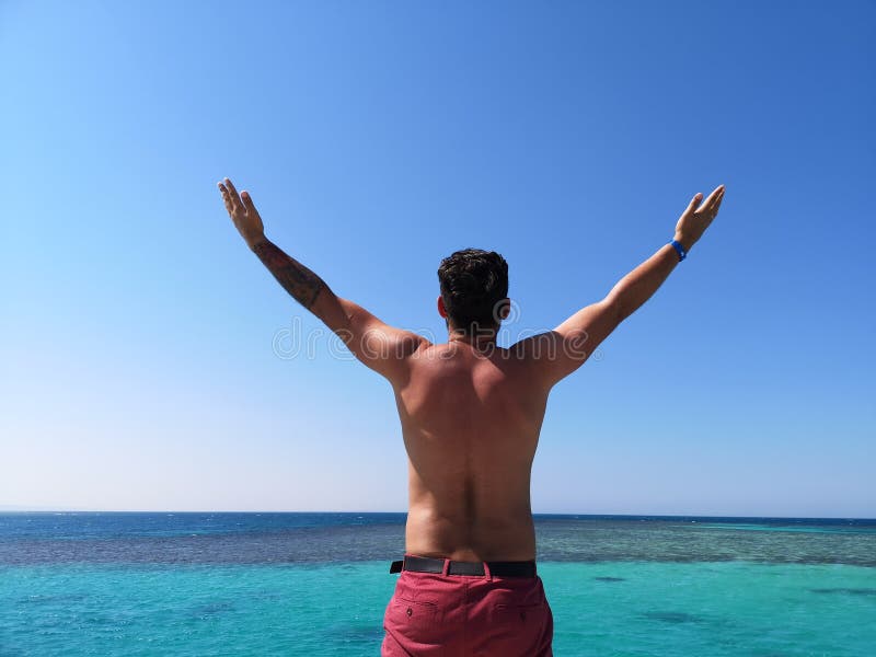 Men`s Back Against the Backdrop of a Water Plexus of the Sea, Relax and ...