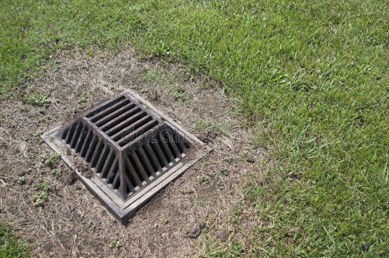 Grate for a Storm Water Drain with Grass and Clippings Stock Image ...