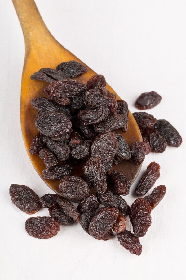 Raisins in Wooden Spoon on Table Stock Image - Image of raisin, healthy ...