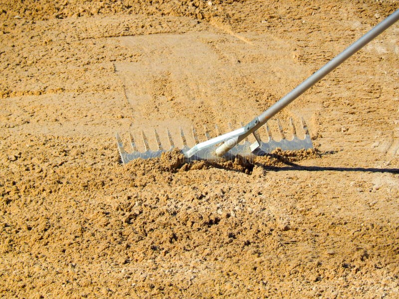 Rake Leveling Yellow Sand on the Playground Stock Image - Image of ...