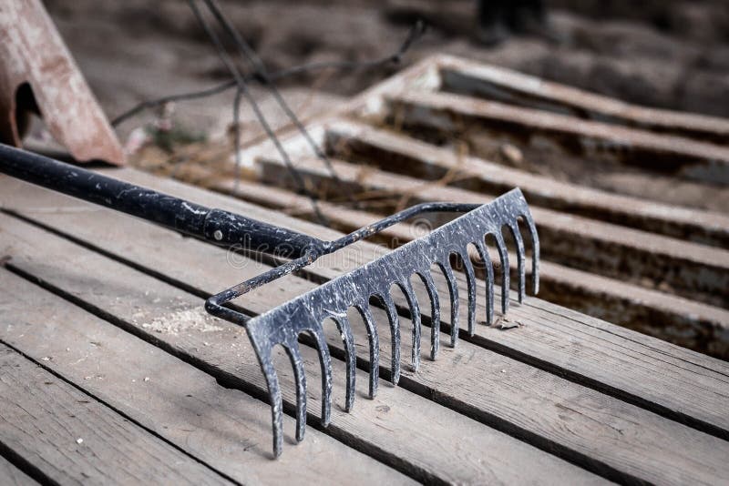 Rake and Its Shadow in Front of Old Wooden Barn. Stock Image - Image of ...