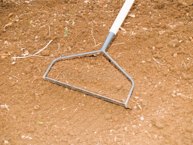 A Rake Raking Soil on the Plot Stock Image - Image of circle, pattern ...