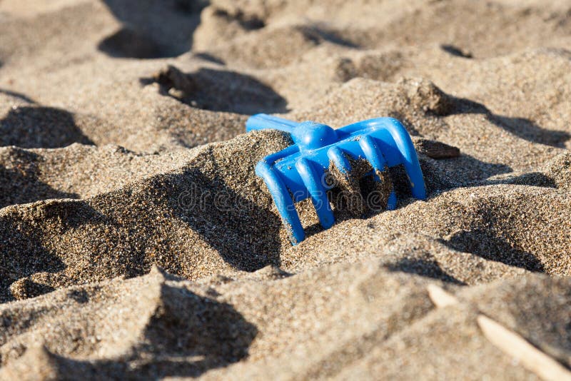 Rake on sand stock image. Image of summer, leisure, container - 24502373