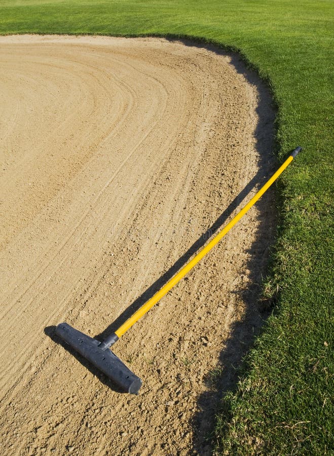 Rake in sand bunker stock photo. Image of recreation - 11864042