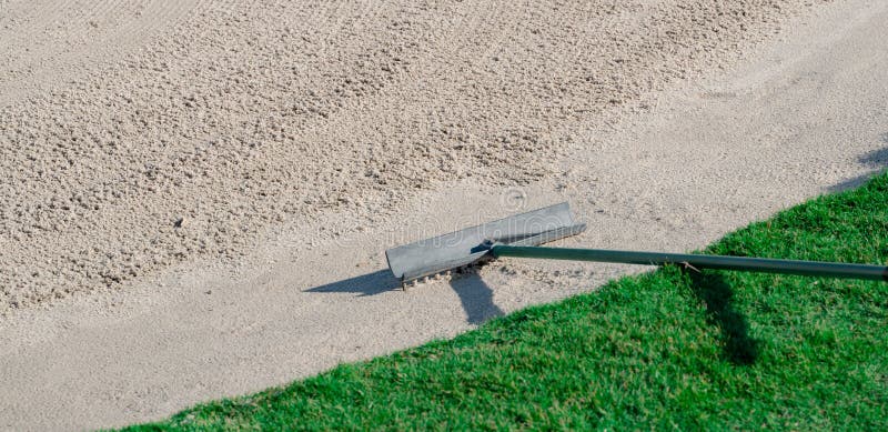Rake in the Sand Trap on a Golf Course Stock Photo - Image of playing ...