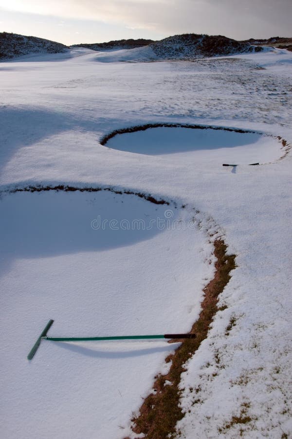 Rakes in Bunkers on a Snow Covered Golf Course Stock Photo - Image of ...