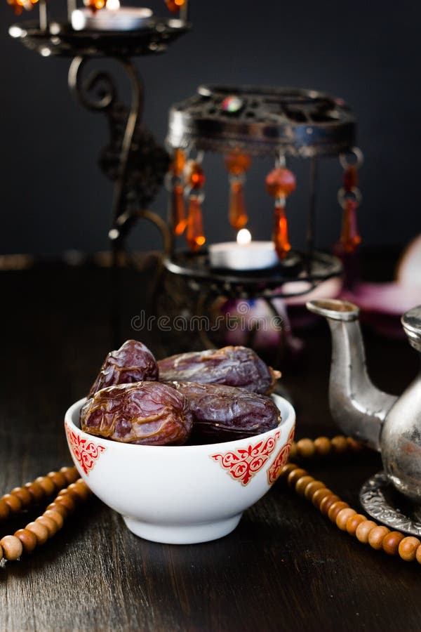 Ramadan Fasting - Dates for Iftar in Bowl on Wooden Table. Stock Photo ...
