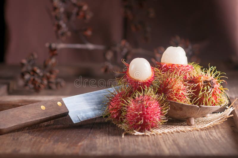 Rambutan and Knife on Wood Table Stock Photo - Image of asian, organic ...