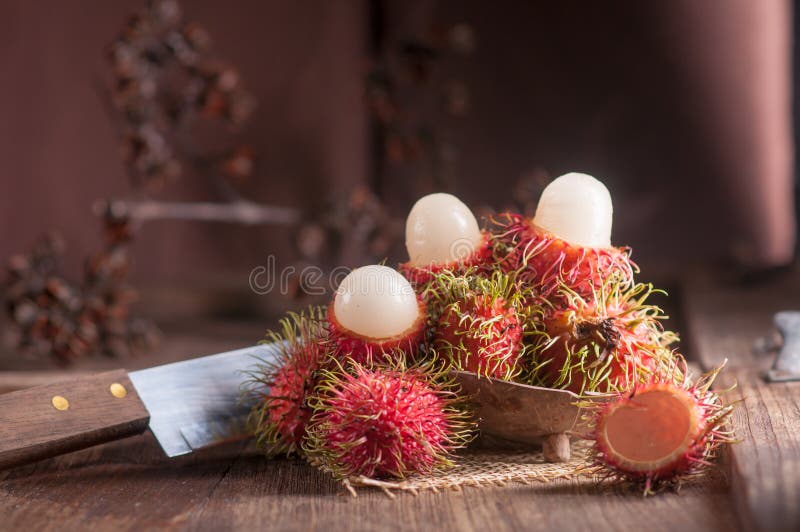 Rambutan and Knife on Wood Table Stock Image - Image of plate, colorful ...