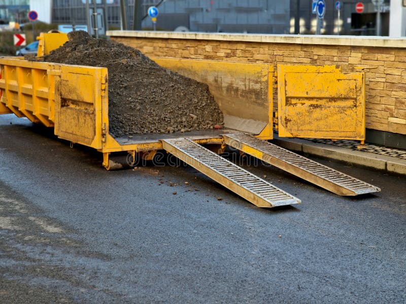 Ramps for a Loader Carrying Soil into a Stock Image - Image of yellow ...