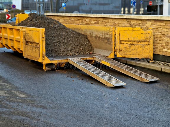 Ramps for a Loader Carrying Soil into a Stock Image - Image of yellow ...