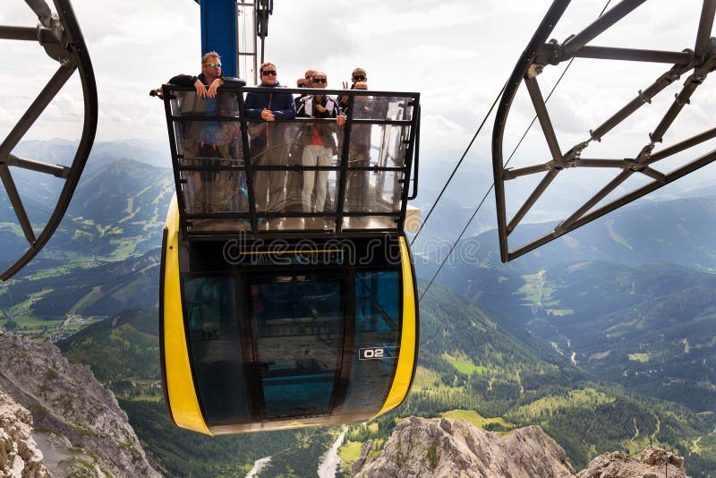 Tourists on Top of Gondola in the Upper Station of the Dachstein Cable ...