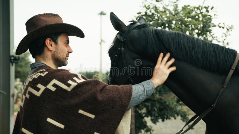 In the Ranch Cowboy and Black Horse Stock Photo - Image of riding ...