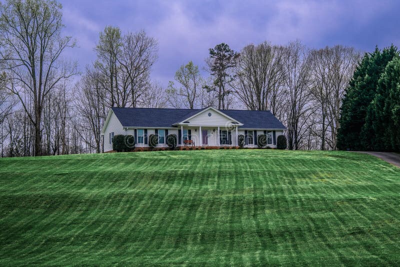 Ranch House on Grassy Hill stock photo. Image of yard - 217138030