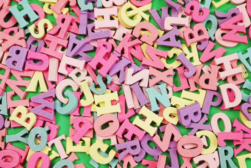 Random Colorful Alphabet and Yellow Alarm Clock on a Red Background ...