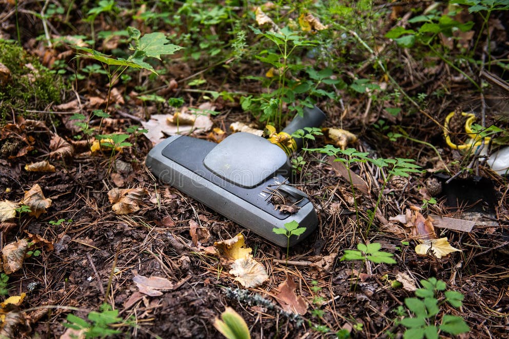 Random Garbage Junk Items Left in Nature and Forests. Vacuum Cleaner ...