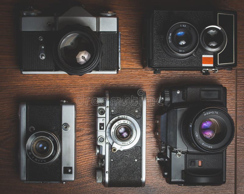 Random Retro Cameras on Wooden Table Stock Photo - Image of wood ...