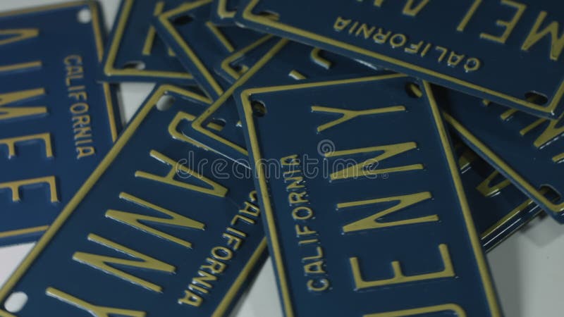 California License Plates Custom Names Rotate on White Surface 4K Stock ...