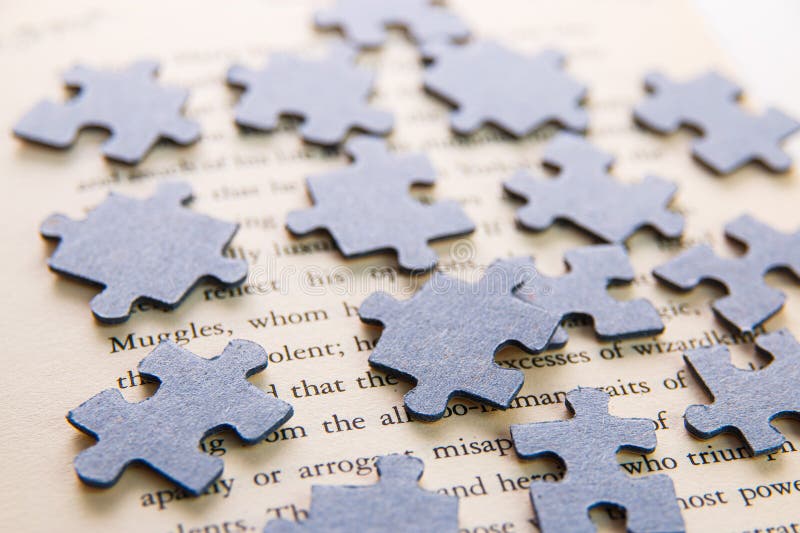 Randomly Scattered Puzzle Pieces Lying on the Pages of a Book Stock ... Randomly Scattered Puzzle Pieces Lying on the Pages of a Book Stock ...