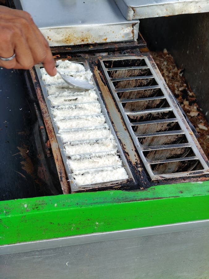 The Rangin Cake Dough is Being Flattened Using a Spoon by the Seller ...
