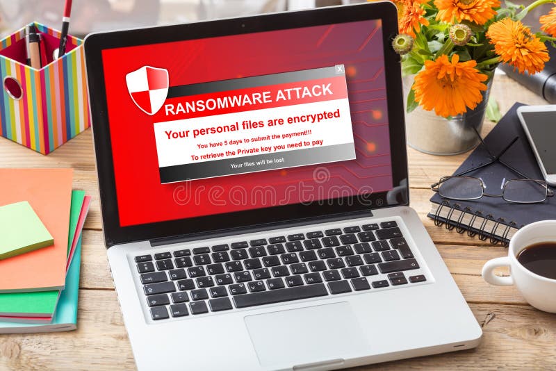 Ransomware Attack Message on a Laptop Screen on an Office Desk Stock ...