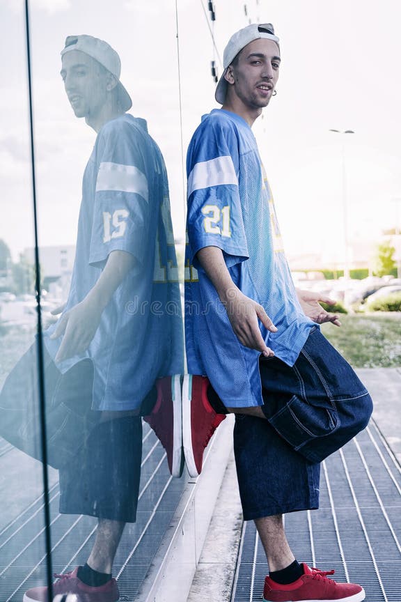 A Rap Singer is Reflected in a Blue Mirror Stock Image - Image of ...
