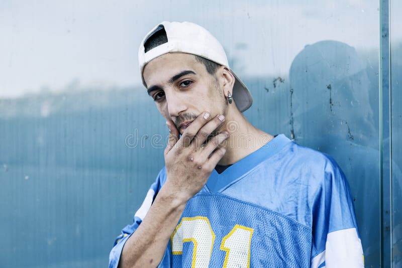 A Rap Singer is Reflected in a Blue Mirror Stock Image - Image of ...