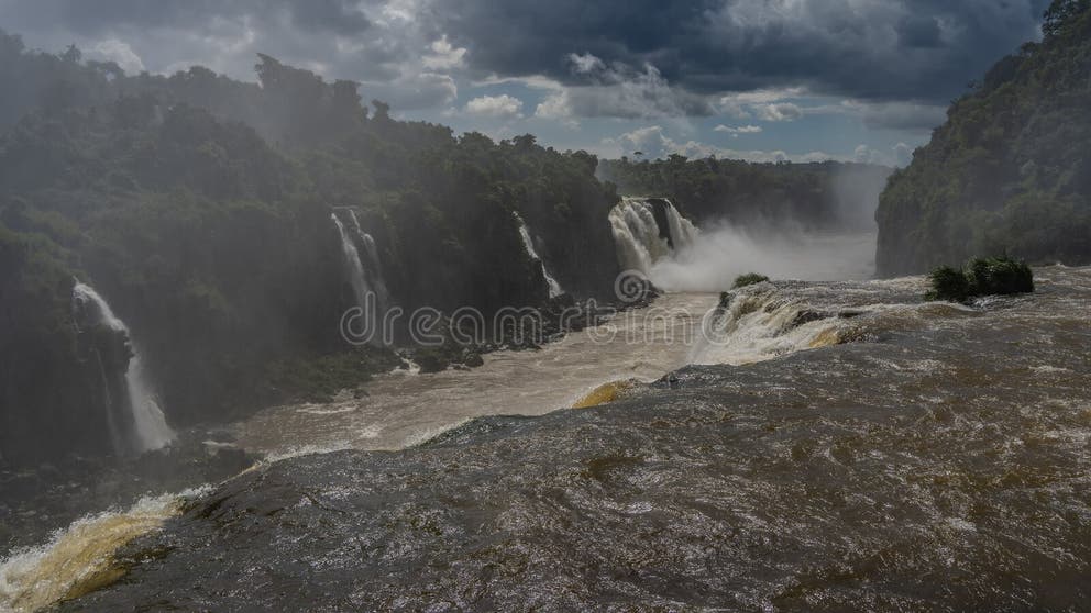The Rapid Flow of Water Collapses from the Edge of the Ledge into the ...