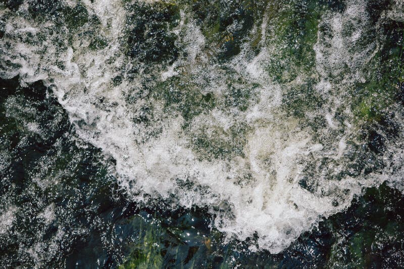 The Rapid Flow of Water with White Waves and Air Bubbles. Top View of a ...