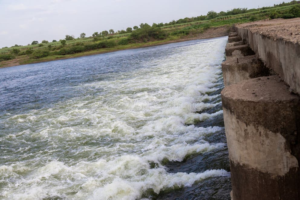 Rapidly Flowing Water with Large Waves Over a Dam on a River, Water ...