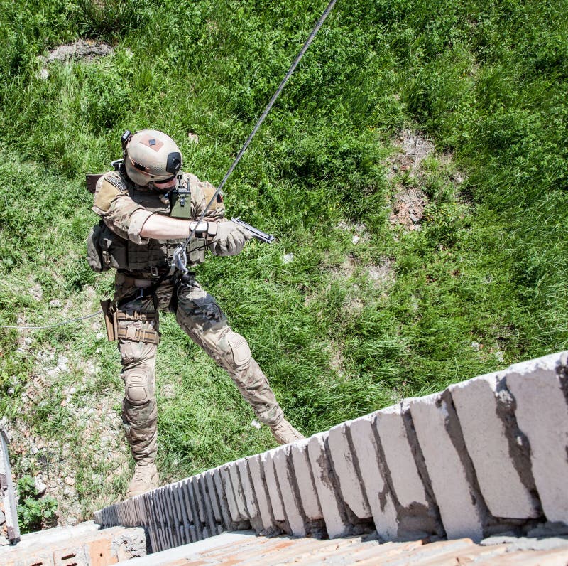 Rappeling with weapons stock image. Image of military - 59572189