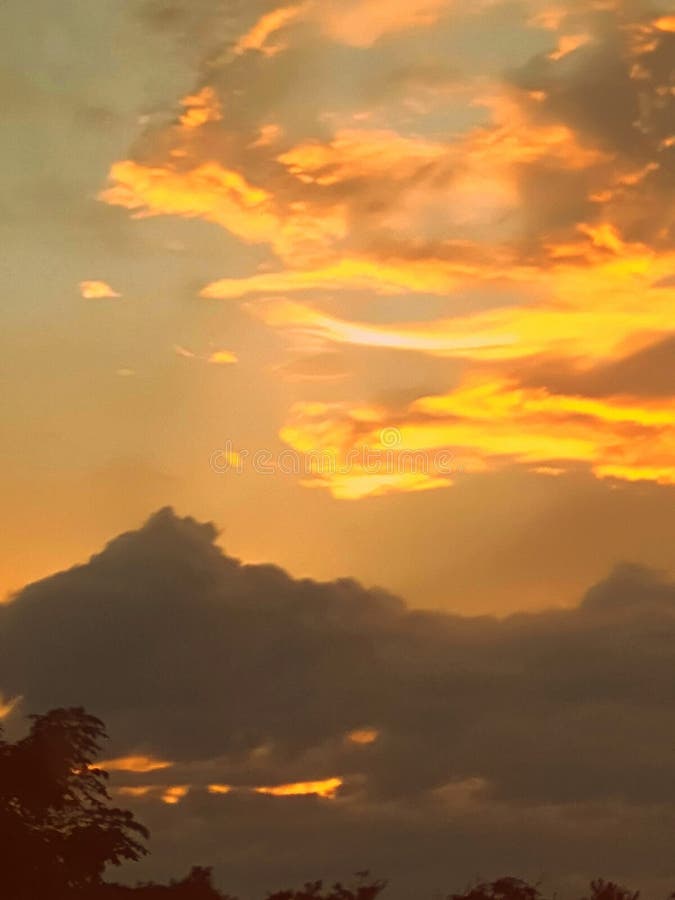 A Rare and Beautiful Sunset Picture Behind the Cloud Stock Photo ...