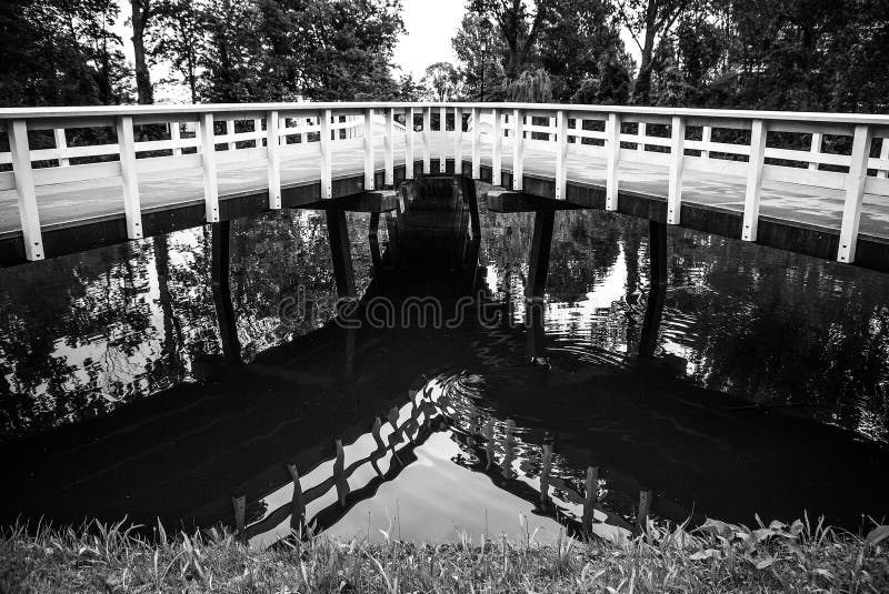 Rare Dutch bridge in park stock photo. Image of front - 78400728
