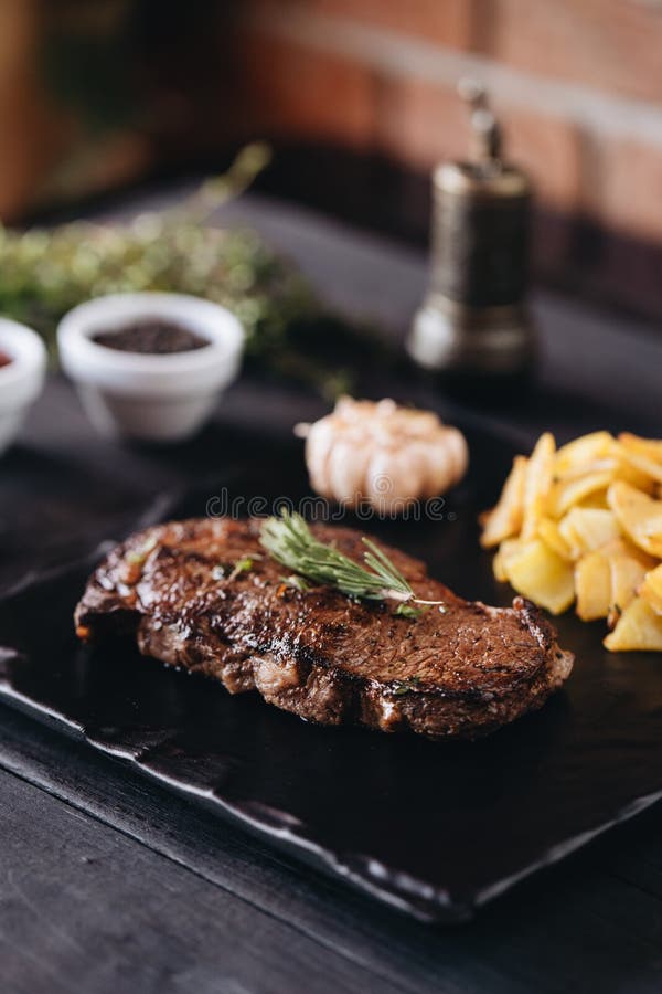 Rare Filet Mignon Beefsteak with Roasted Potatoes Stock Photo - Image ...
