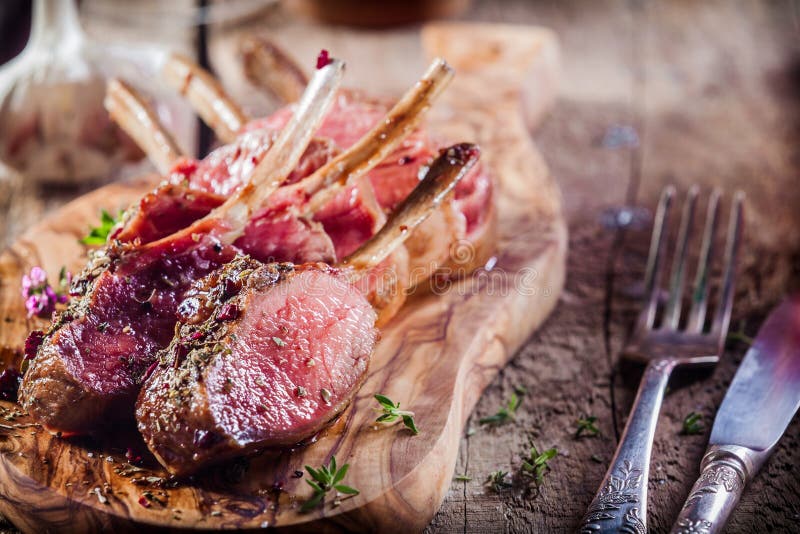 Rare Lamb Chops on Wooden Cutting Board Stock Image - Image of lamb ...