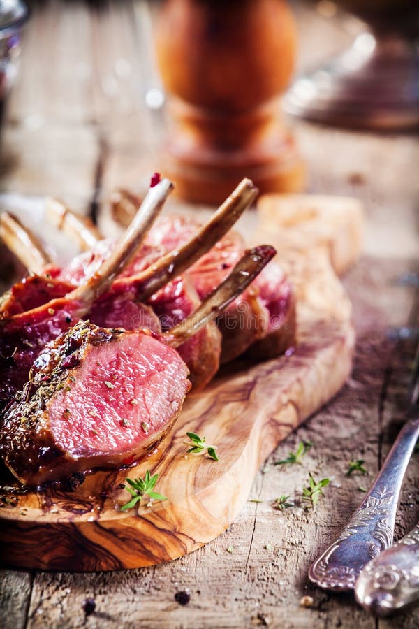 Rare Rectangle of Lamb on Wooden Cutting Board Stock Image - Image of ...