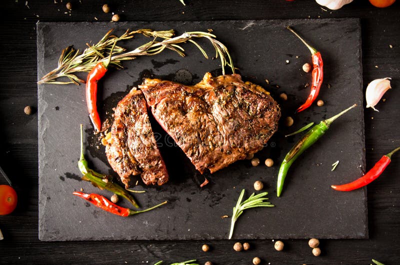 Rare Steak Black Rectangular Plate Garlic Spices Stock Photo - Image of ...