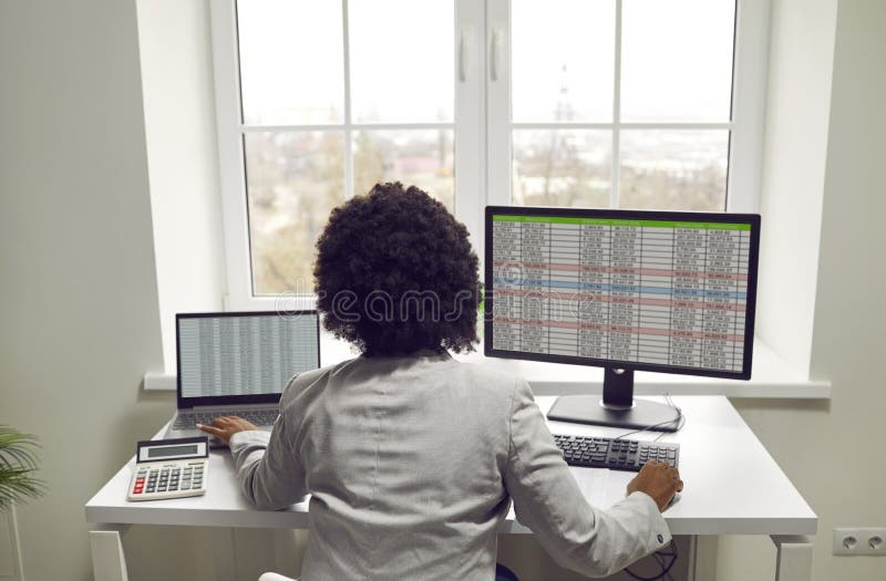 Rare View of Financial Manager Working in Office in Front of Window ...