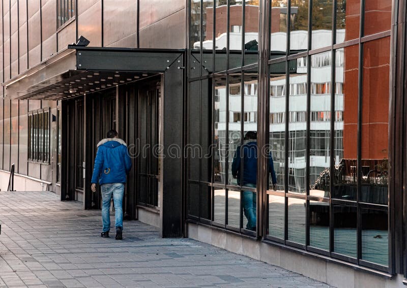 Rare View of a Man Walking in Front of a Building Stock Image - Image ... Rare View of a Man Walking in Front of a Building Stock Image - Image ...